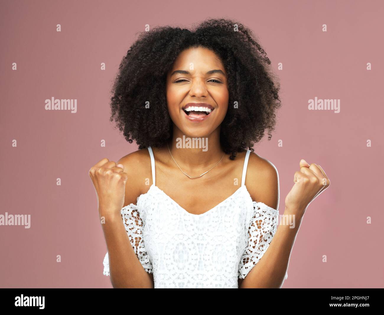 Guess who just got lucky. a beautiful young woman cheering against a ...