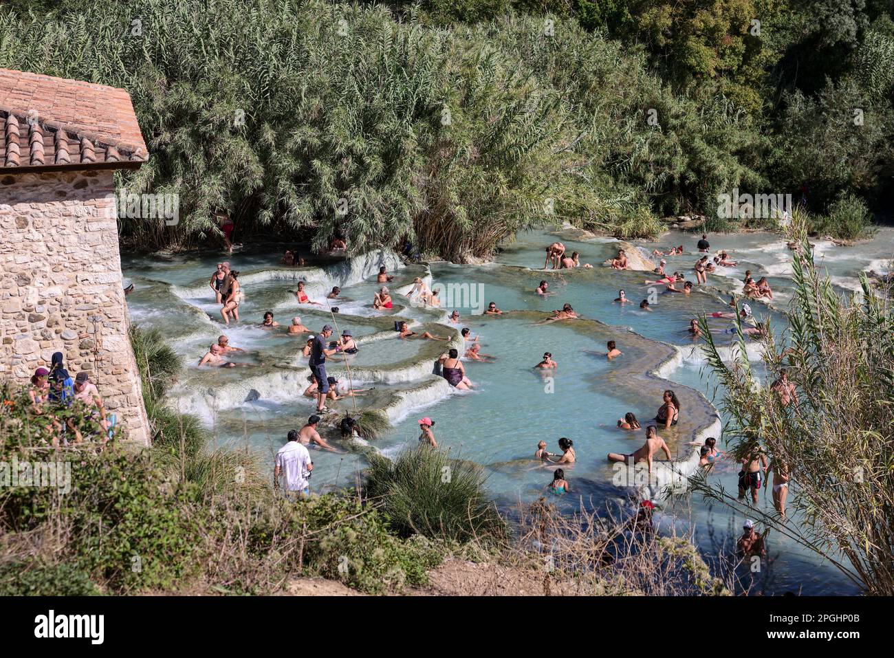 Saturnia, Italy - September 13, 2022: People are bathing in the hot ...