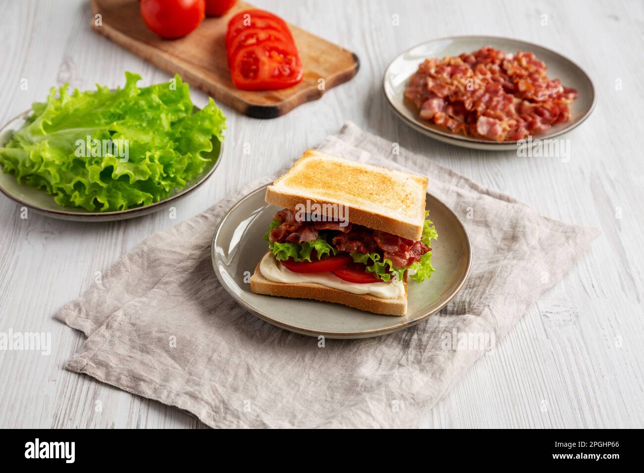 Homemade BLT Sandwich (Bacon, Lettuce and Tomato) on a Plate, side view ...