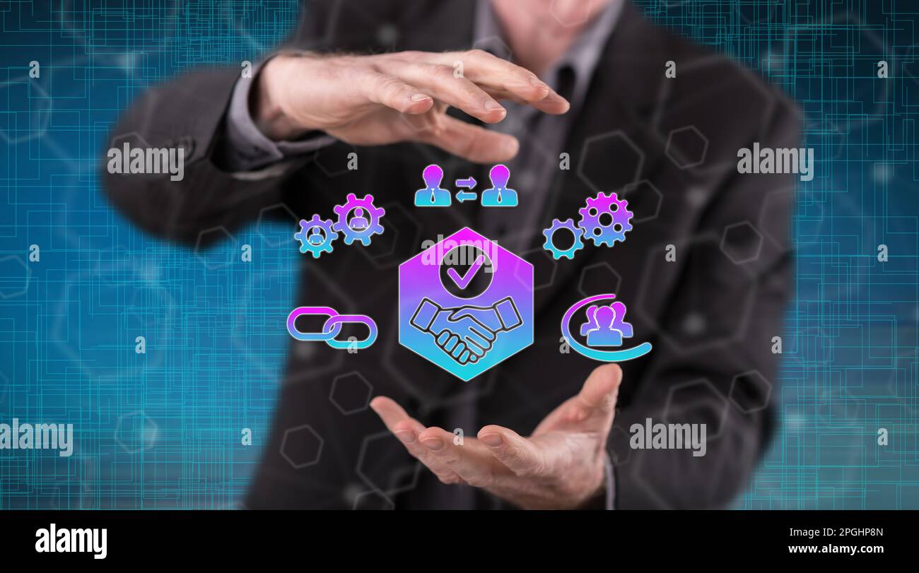 Trust concept between hands of a man in background Stock Photo - Alamy