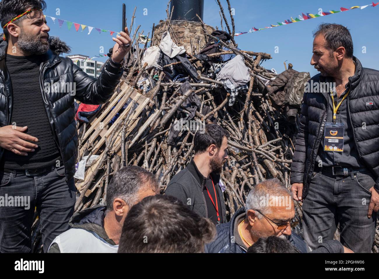 Diyarbakir, Turkey. 21st Mar, 2023. People throw their coats and ...