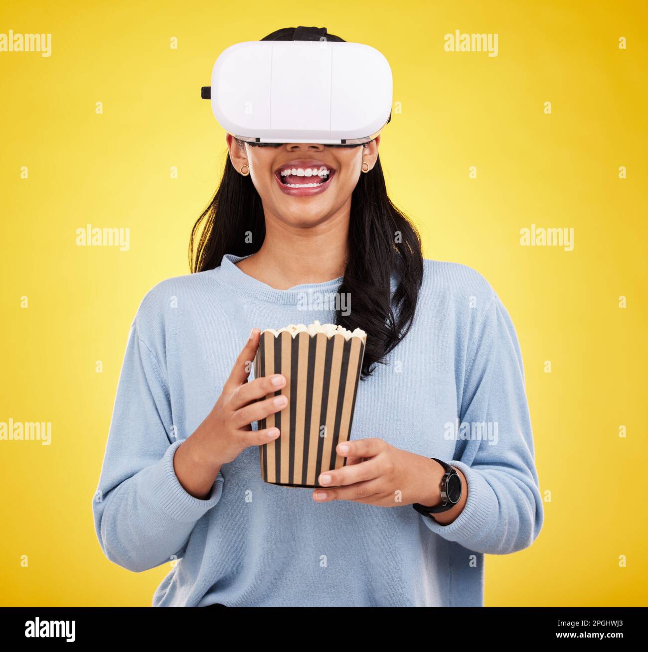 Woman is eating popcorn, happy and VR goggles, snack for watching tv or ...