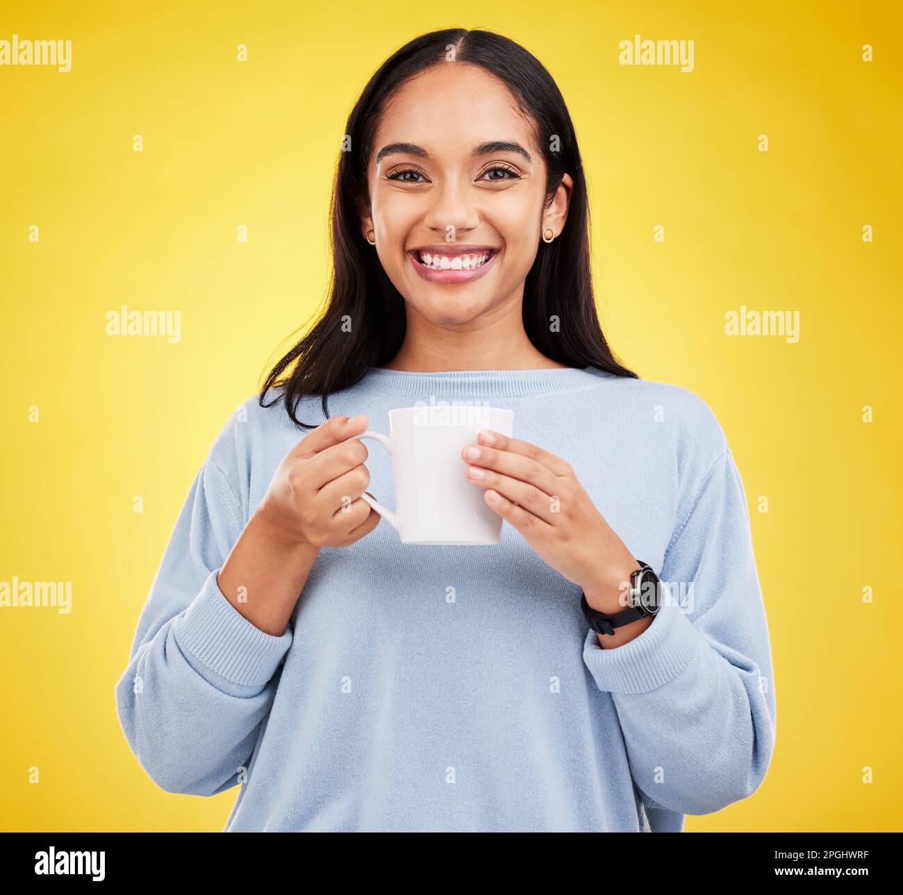 Smiling portrait, coffee mug and happy woman in a studio with a smile ...
