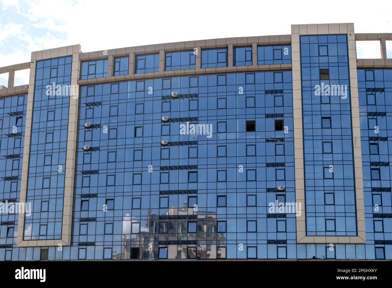 Construction of a modern high-rise building. Real estate and corporate ... Construction of a modern high-rise building. Real estate and corporate ...