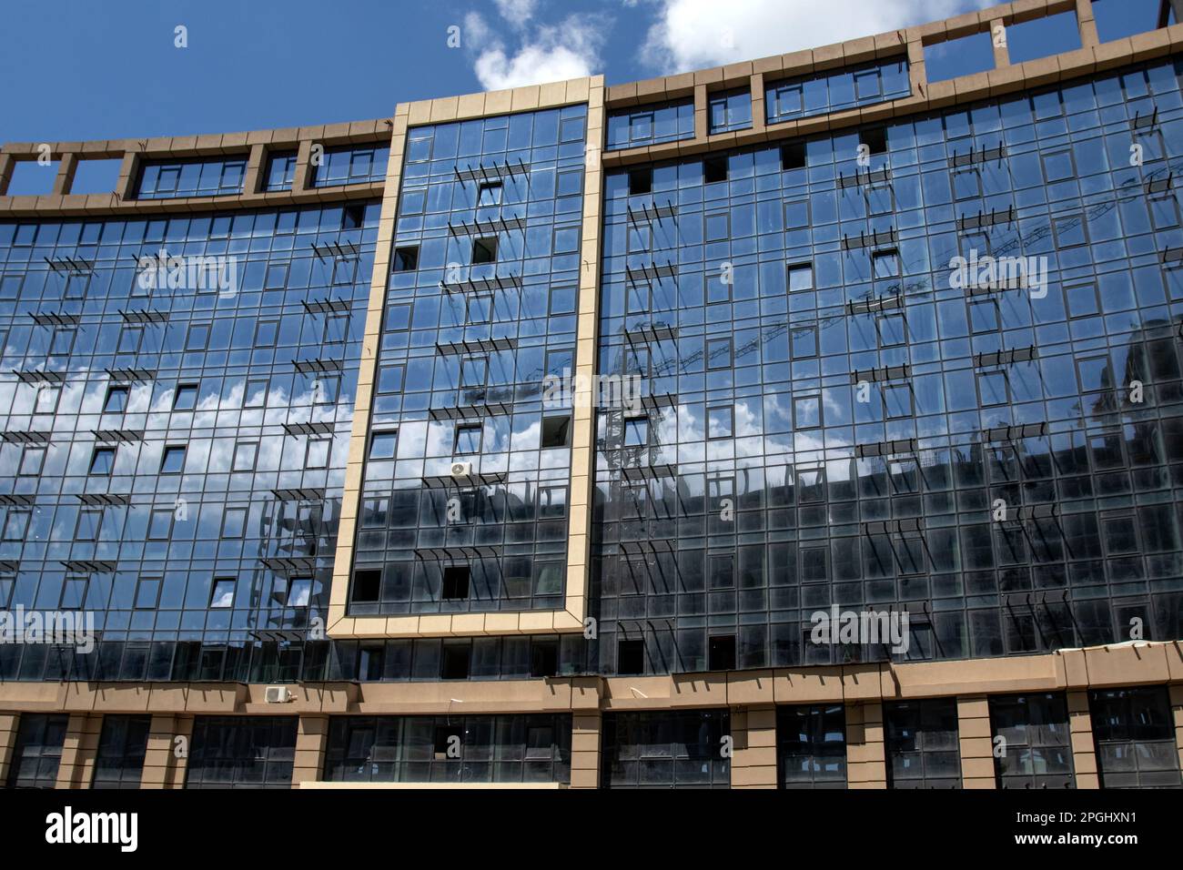 Construction of a modern high-rise building. Real estate and corporate ... Construction of a modern high-rise building. Real estate and corporate ...