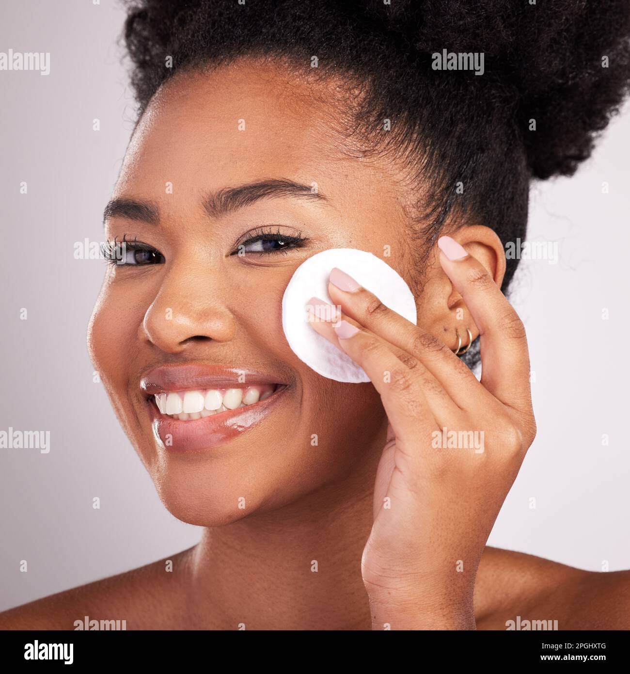 Black woman, cotton and skincare in studio with smile in headshot ...