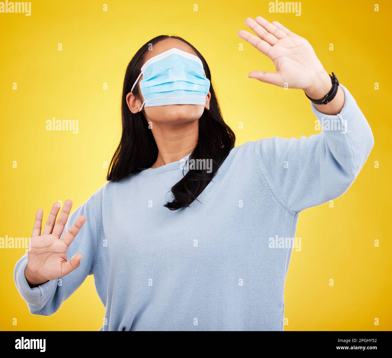 Face mask, covid and woman in blindfold in studio for medical ...