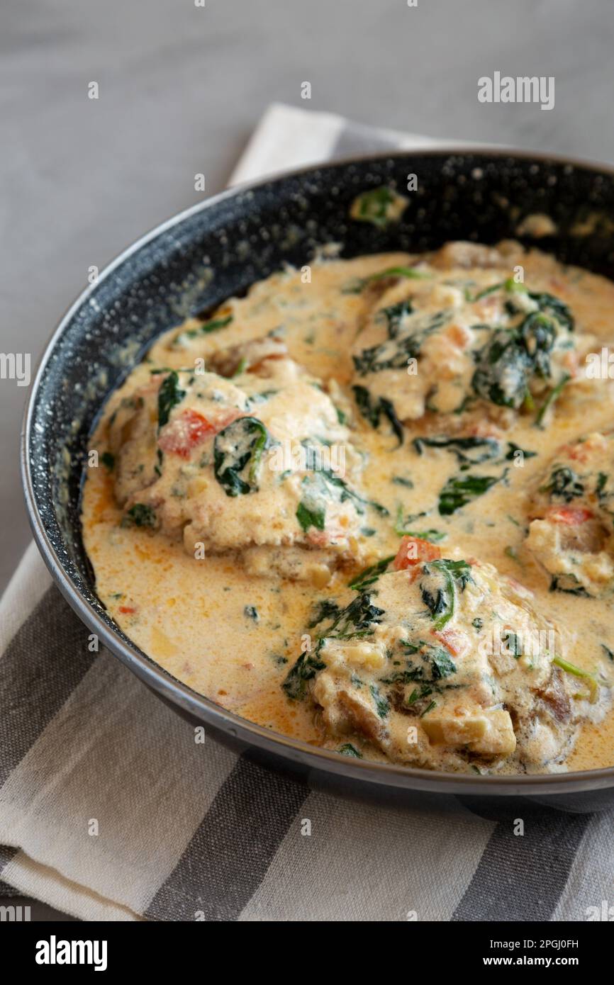 Homemade Creamy Tuscan Chicken with Spinach in a Pan, side view Stock ...