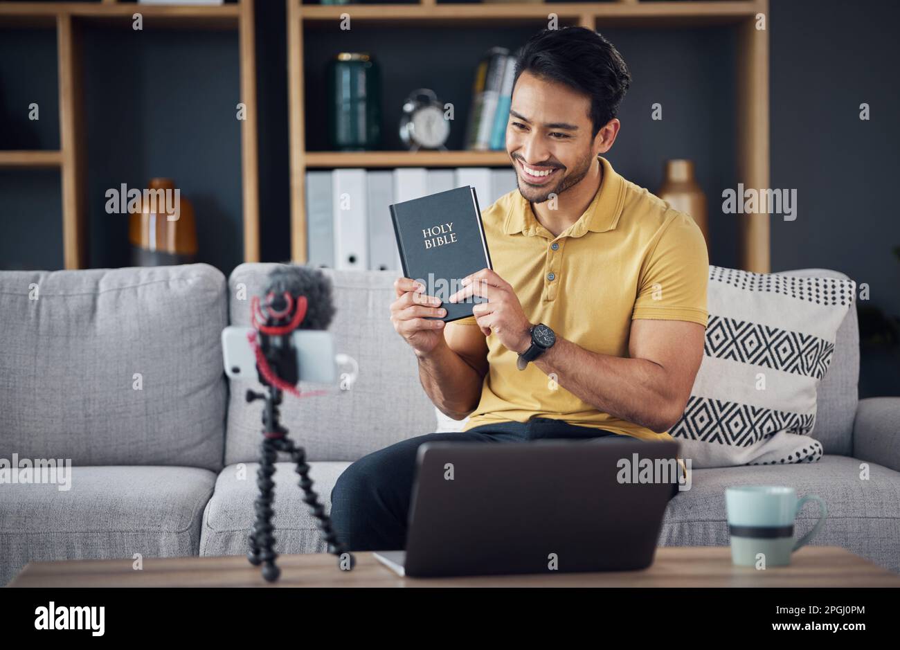 Bible, smile and man study with phone and microphone online live ...