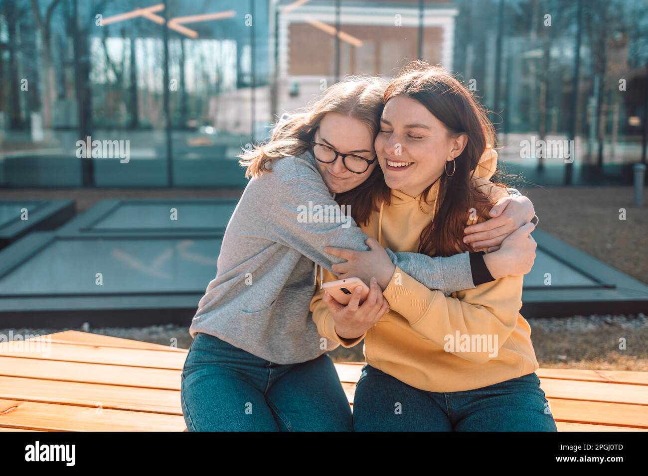 Close up two girls hugging other hi-res stock photography and images ...