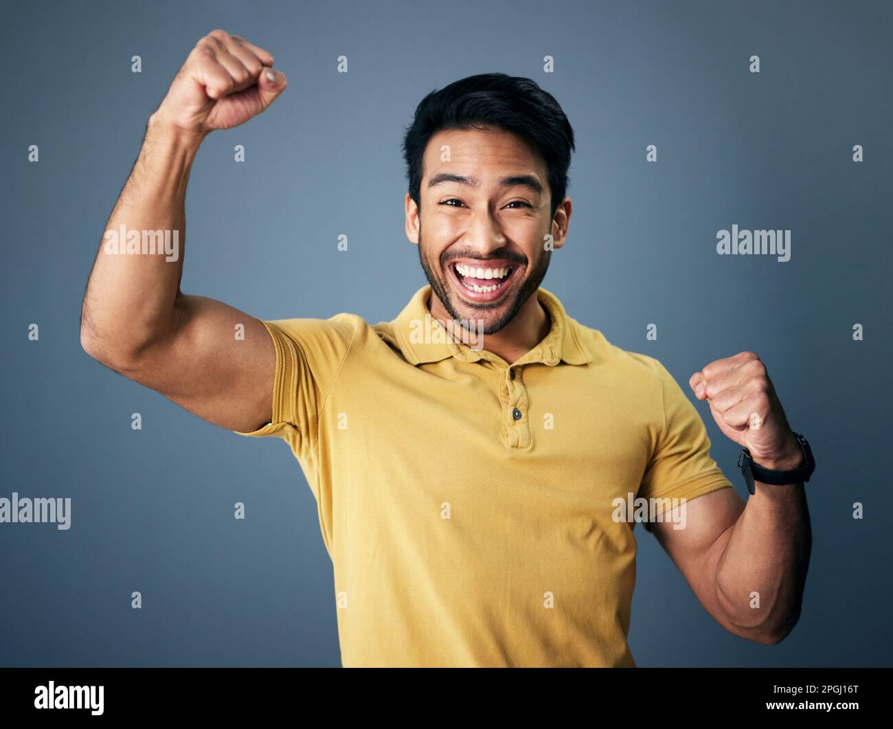 Indian man, celebrate and fist in studio portrait for winning mindset ...