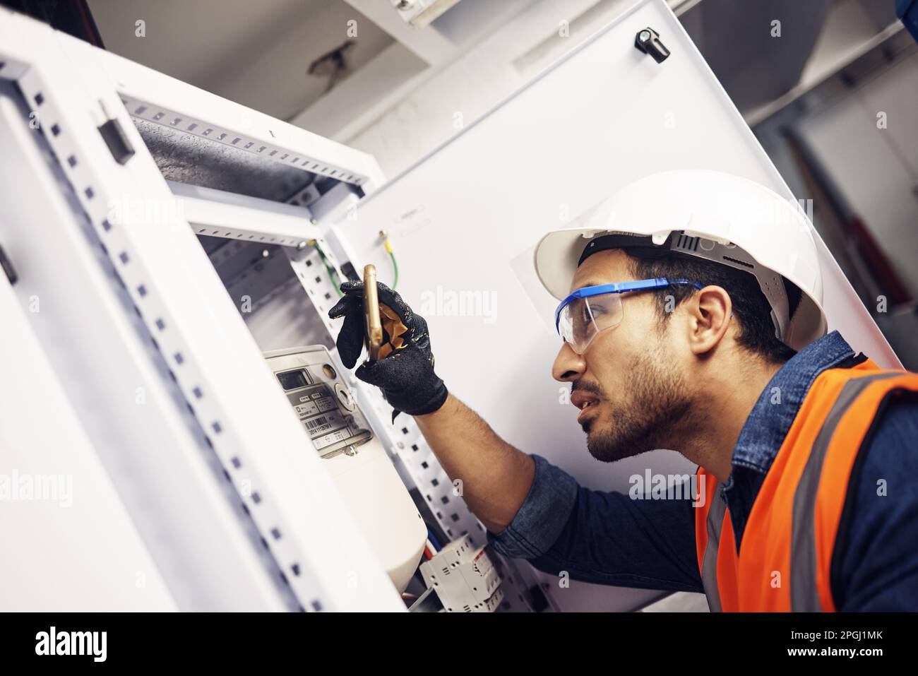 Electrician, engineer and maintenance man with screwdriver in control ...