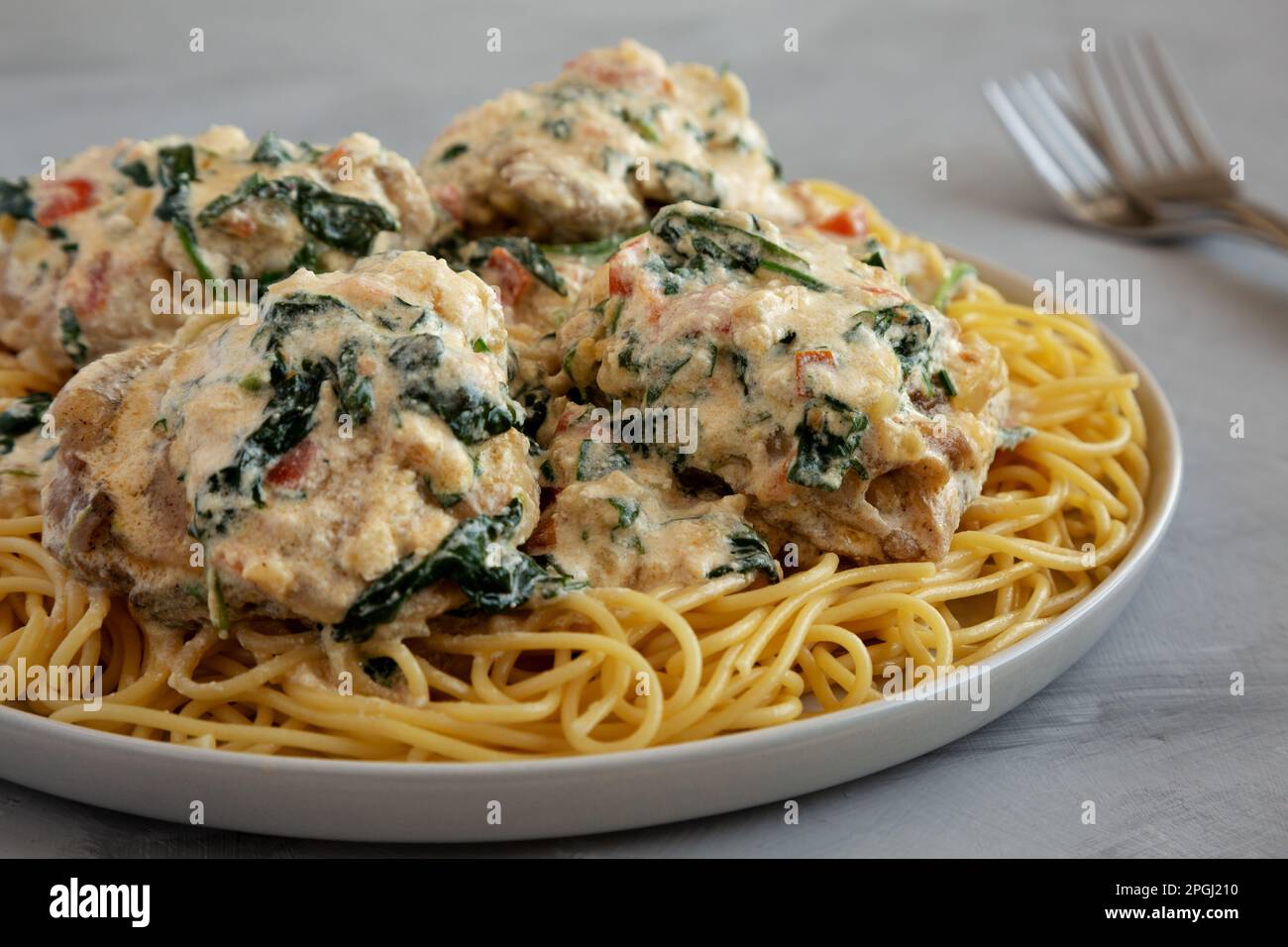 Homemade Creamy Tuscan Chicken with Spinach and Spaghetti Pasta, side ...