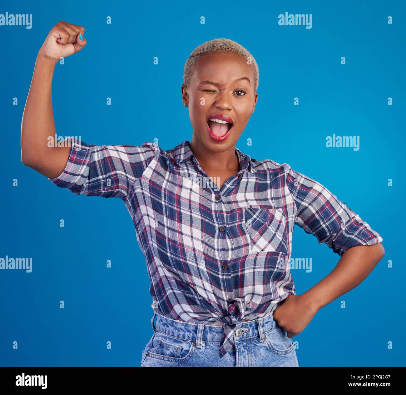 Wink, arm flex and portrait of black woman in studio for empowerment ...