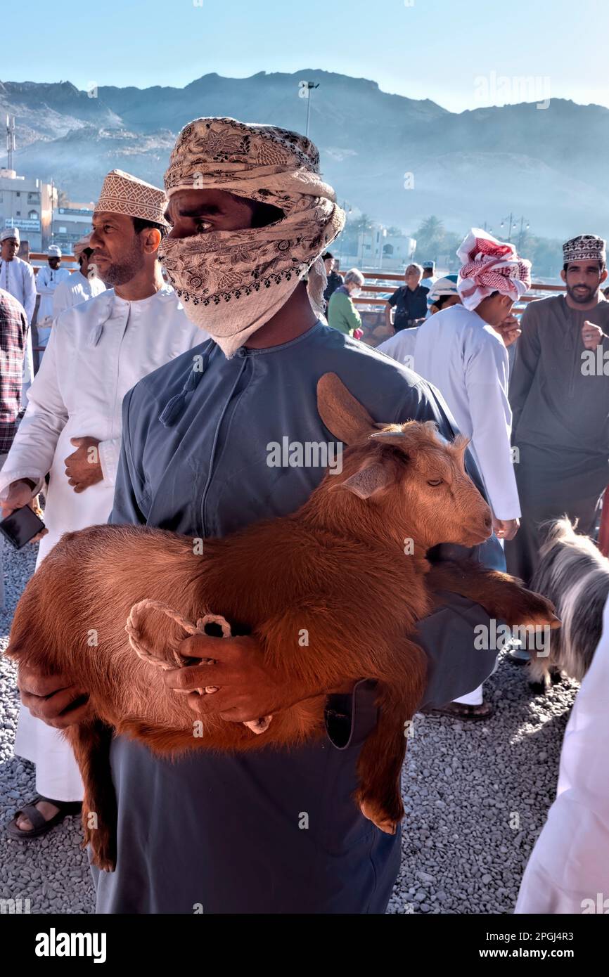 Boy at the Friday goat market, Nizwa, Oman Stock Photo - Alamy