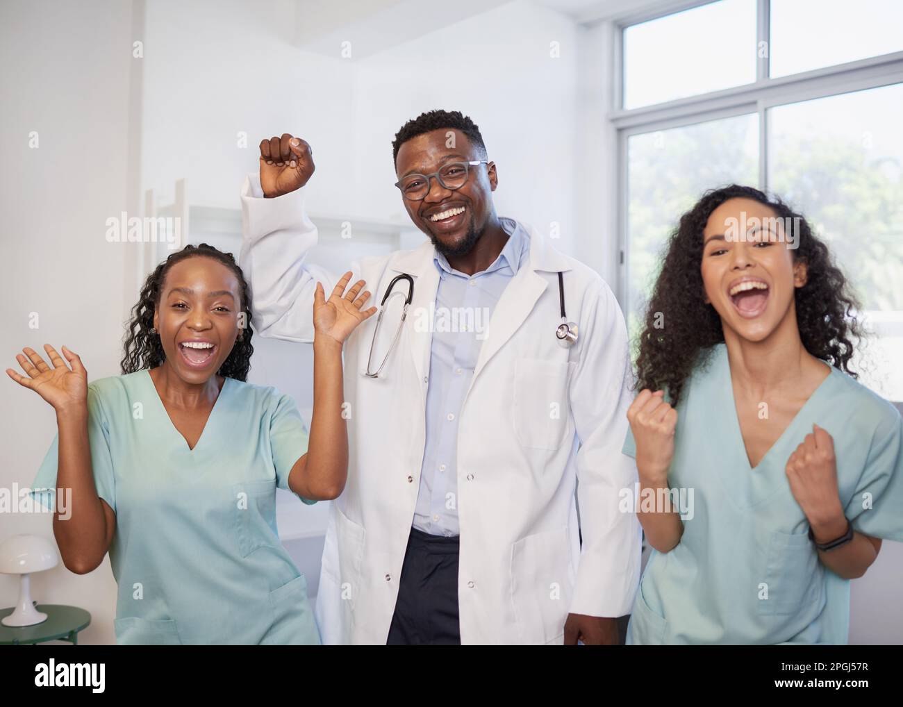 Team of three healthcare professional cheer for success of patient ...
