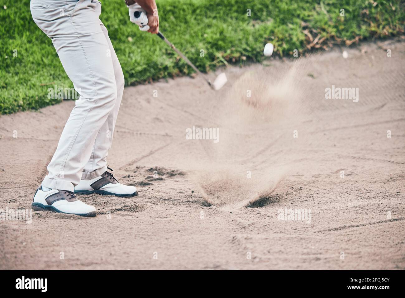 Golf course, man and swing in sand pit for shot, sports and training ...