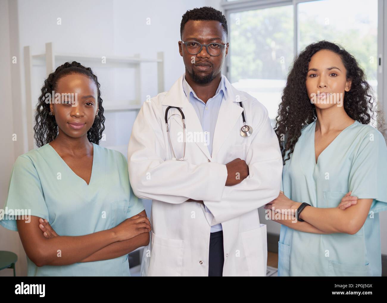 Three healthcare professionals stand hi-res stock photography and ...