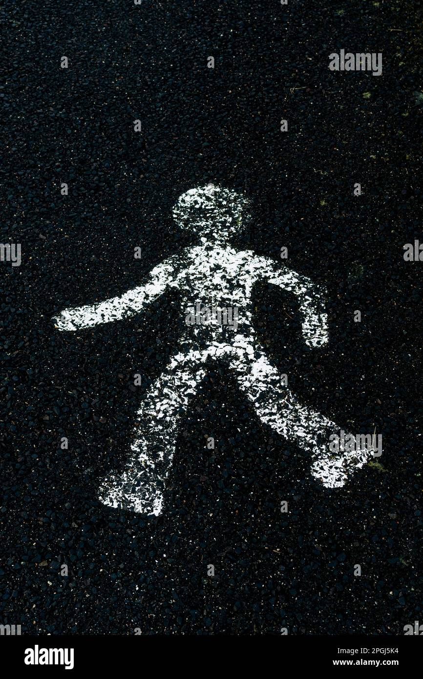 Pedestrian symbol painted on asphalt surface, indicating walking lane ...