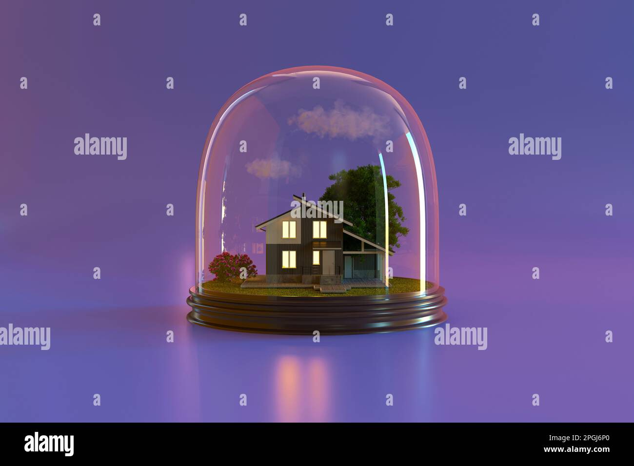 Miniature model of a house and a tree in a glass ball sphere. A card is ...