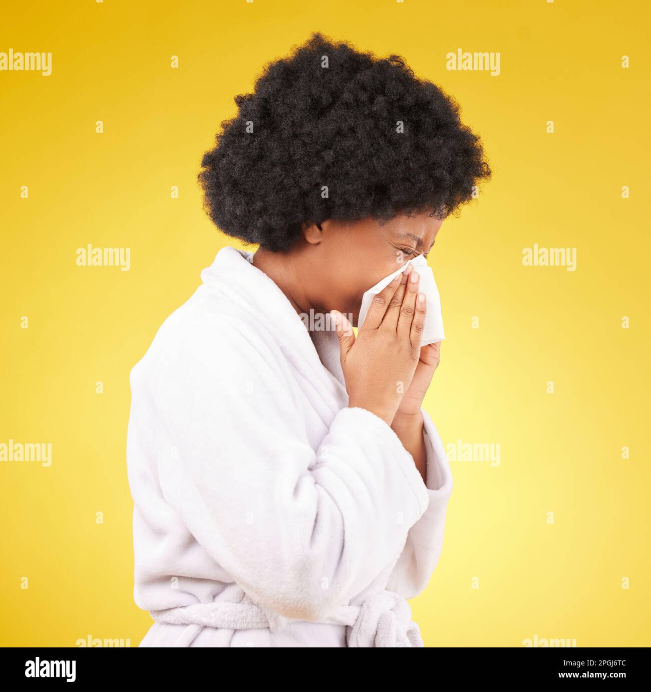 Sick black woman, tissue and blowing nose with afro and morning gown ...