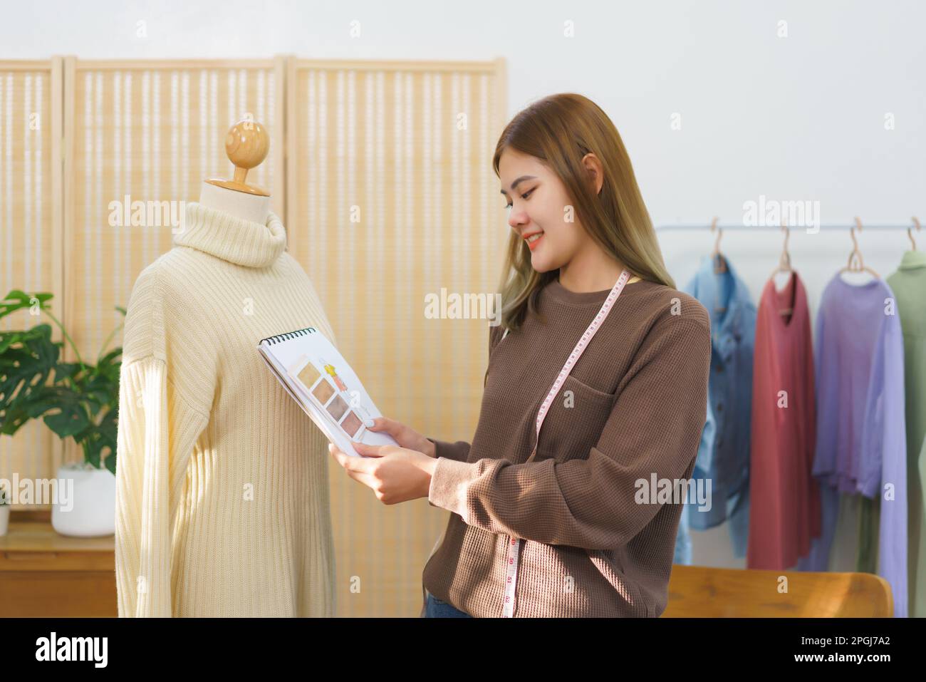 Fashion design concept, Fashion designer choosing color in color swatch ...