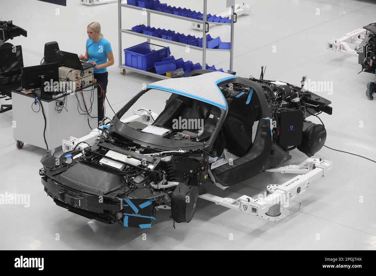 Employee working on an assembly line producing Electric Hyper car Rimac ...