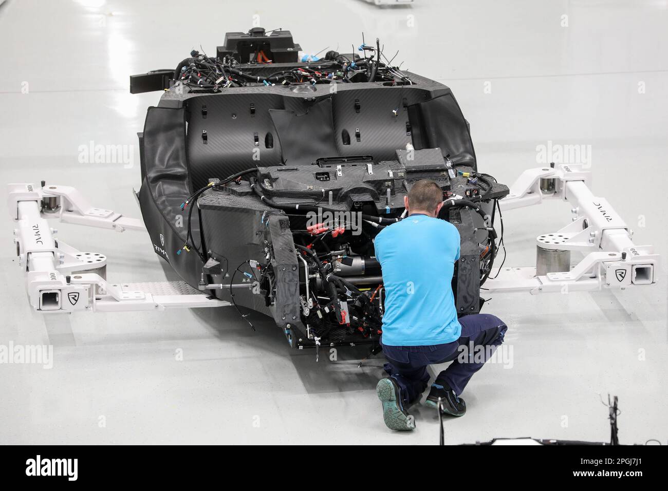 Employee working on an assembly line producing Electric Hyper car Rimac ...