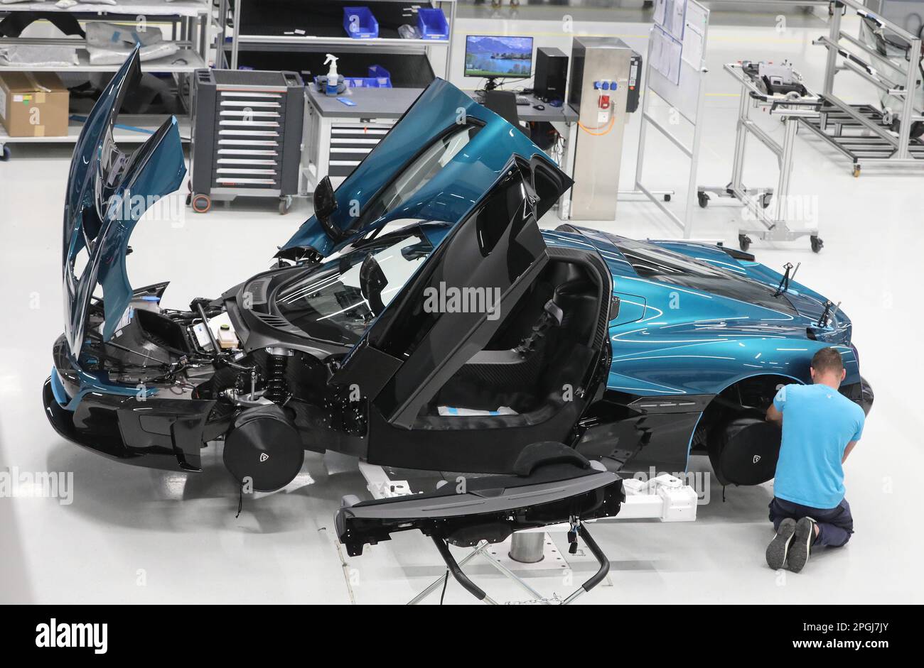Employee working on an assembly line producing Electric Hyper car Rimac ...