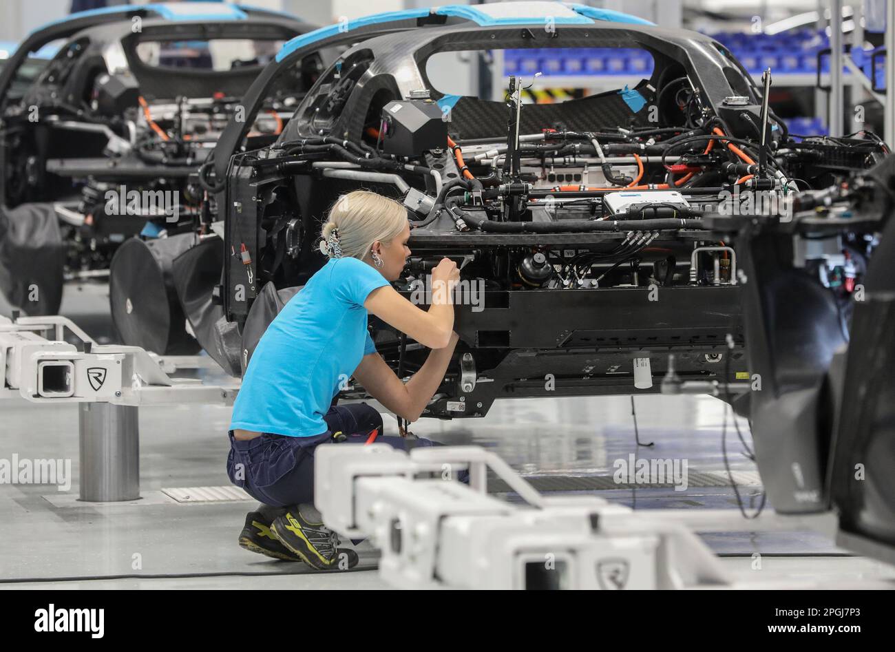 Employee working on an assembly line producing Electric Hyper car Rimac ...