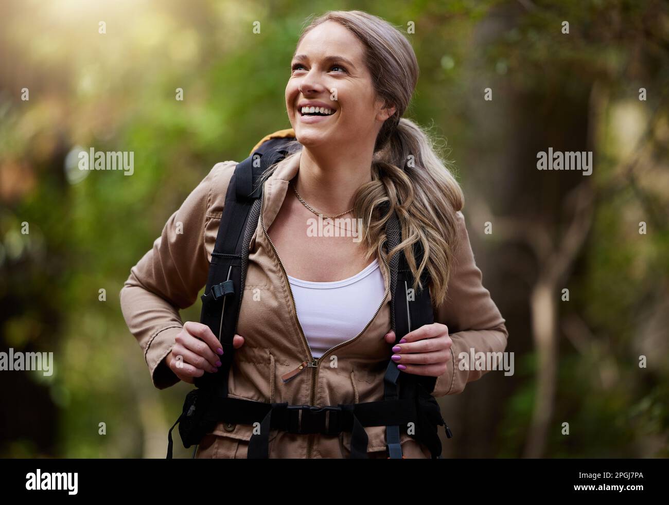 Hiking, happy and woods with a woman outdoor, walking in nature or the ...