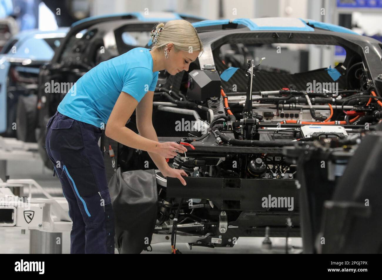 Employee working on an assembly line producing Electric Hyper car Rimac ...