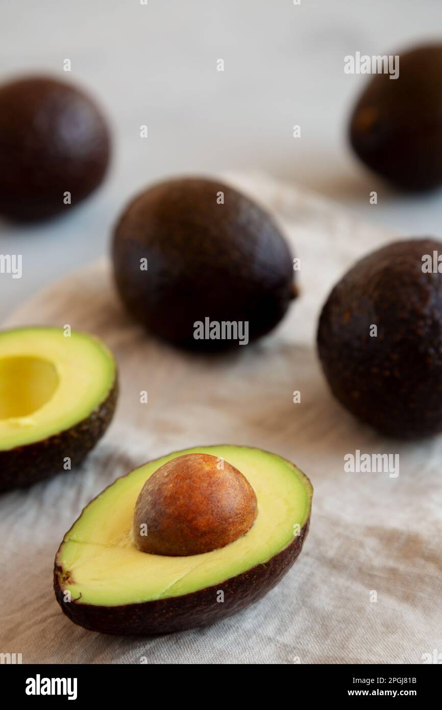 Raw Organic Hass Avocados on a gray background, side view Stock Photo ...