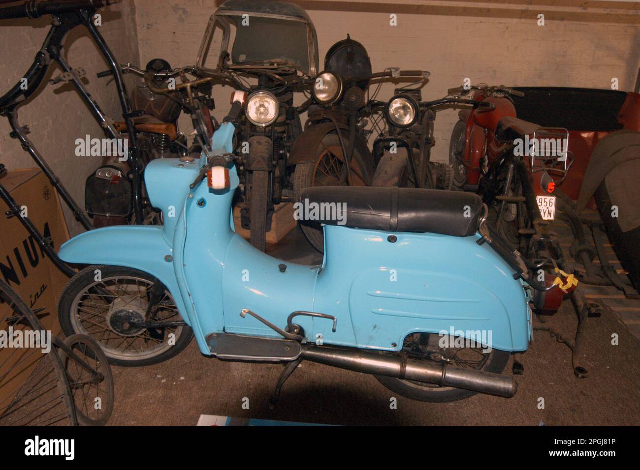 old vintage motorbike in a garage Stock Photo - Alamy