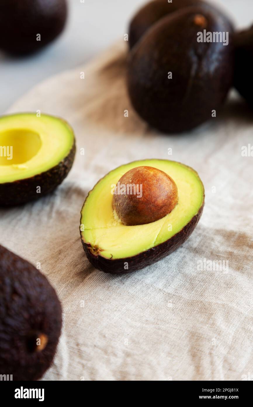 Raw Organic Hass Avocados on a gray background, side view Stock Photo ...