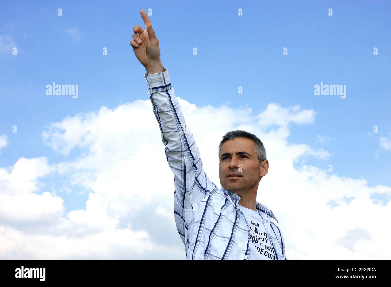 man pointing up with outstretched arm Stock Photo - Alamy