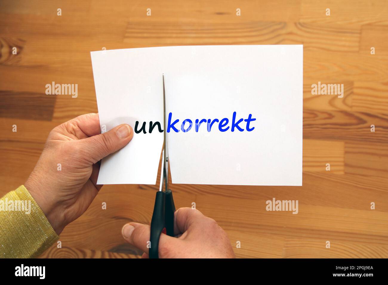 word written on a paper, the negation 'un' is cut off, unkorrekt ...