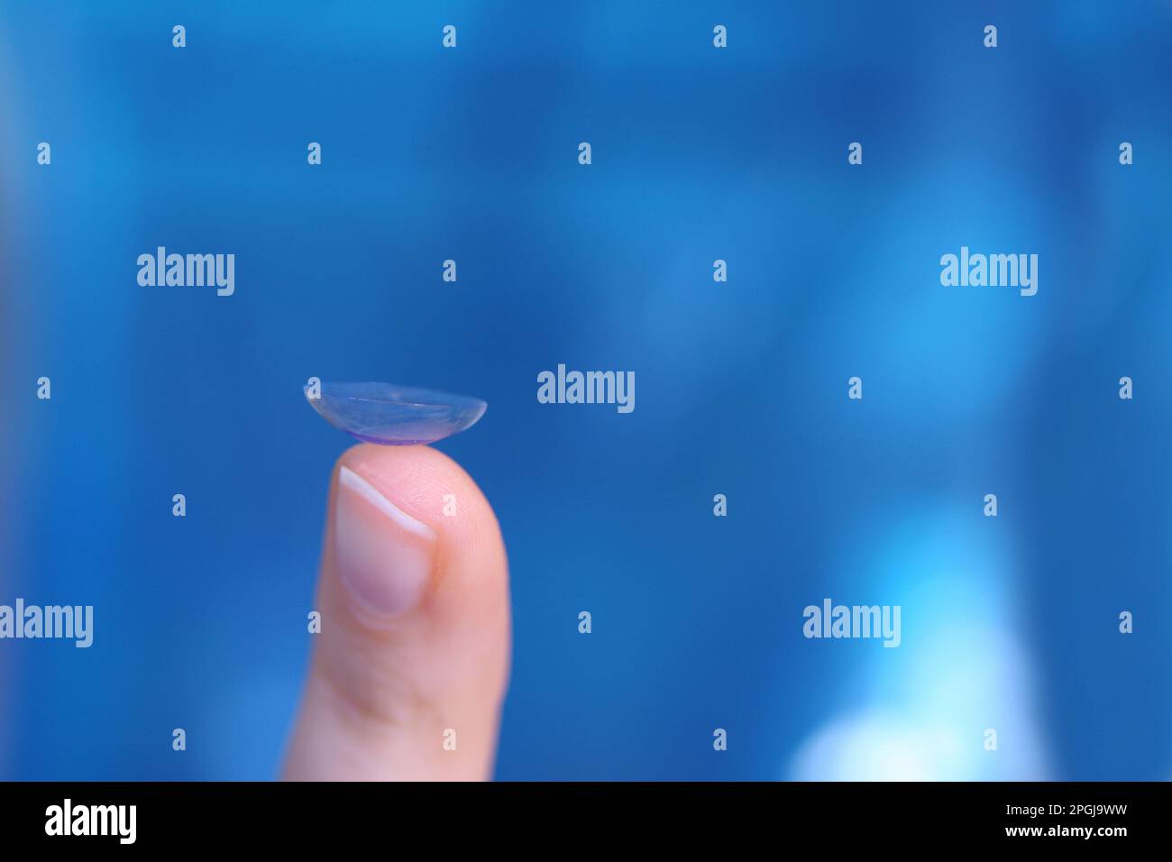soft contact lens on the tip of a finger Stock Photo - Alamy