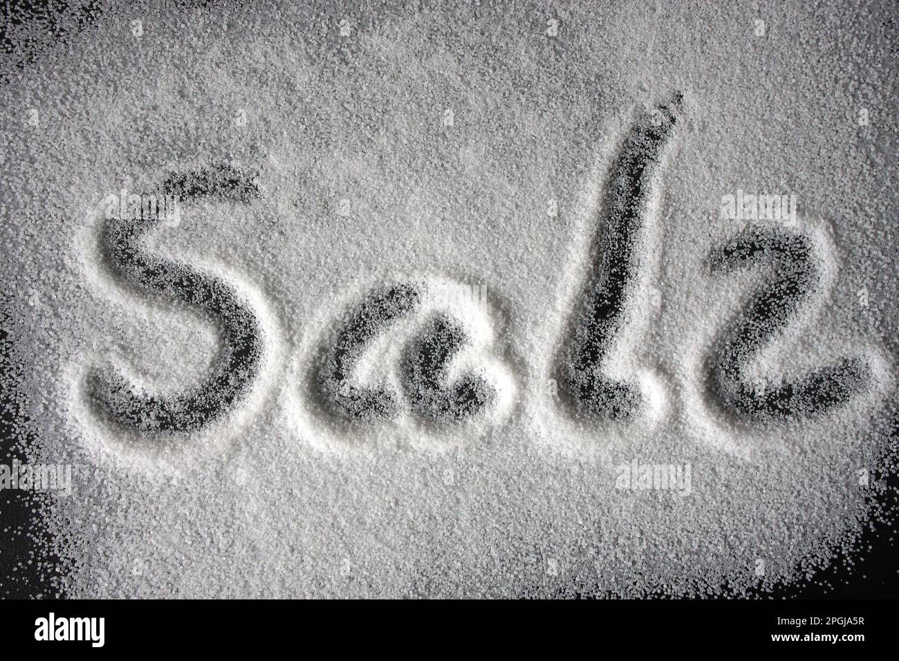 the German word Salz, salt, written in salt Stock Photo - Alamy
