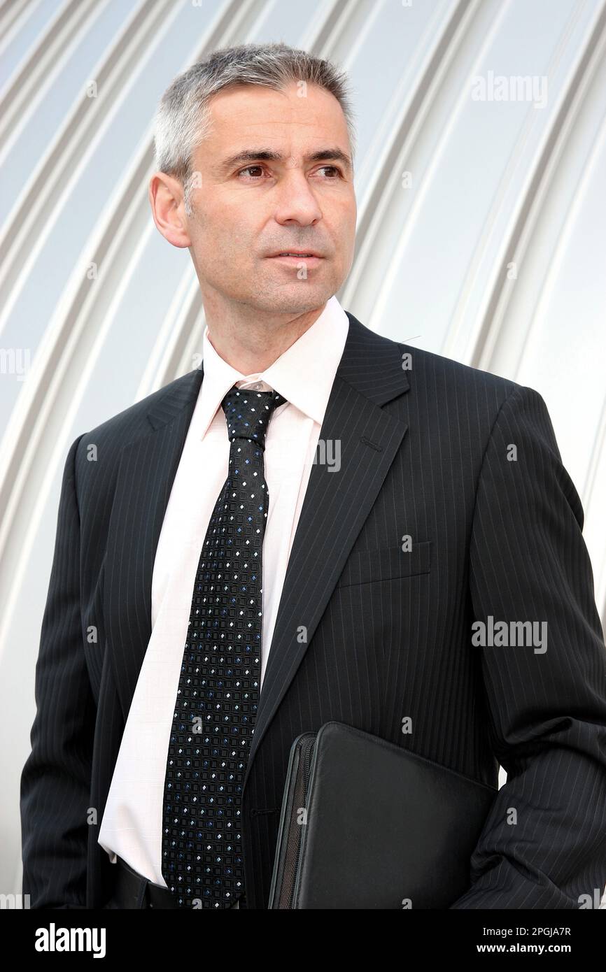 Folder under the arm hi-res stock photography and images - Alamy