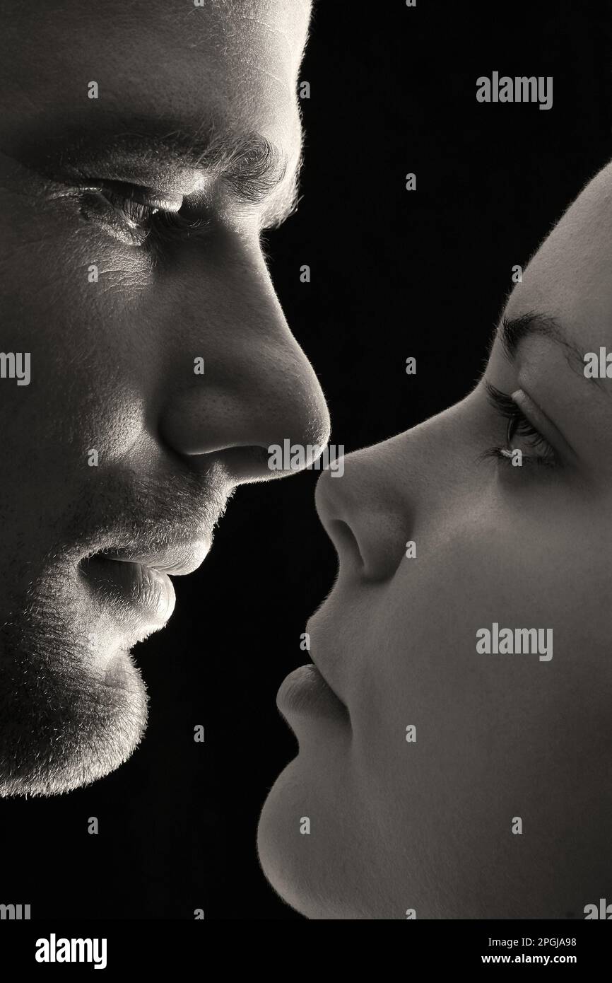 couple looking deeply into each other's eyes, side view Stock Photo - Alamy