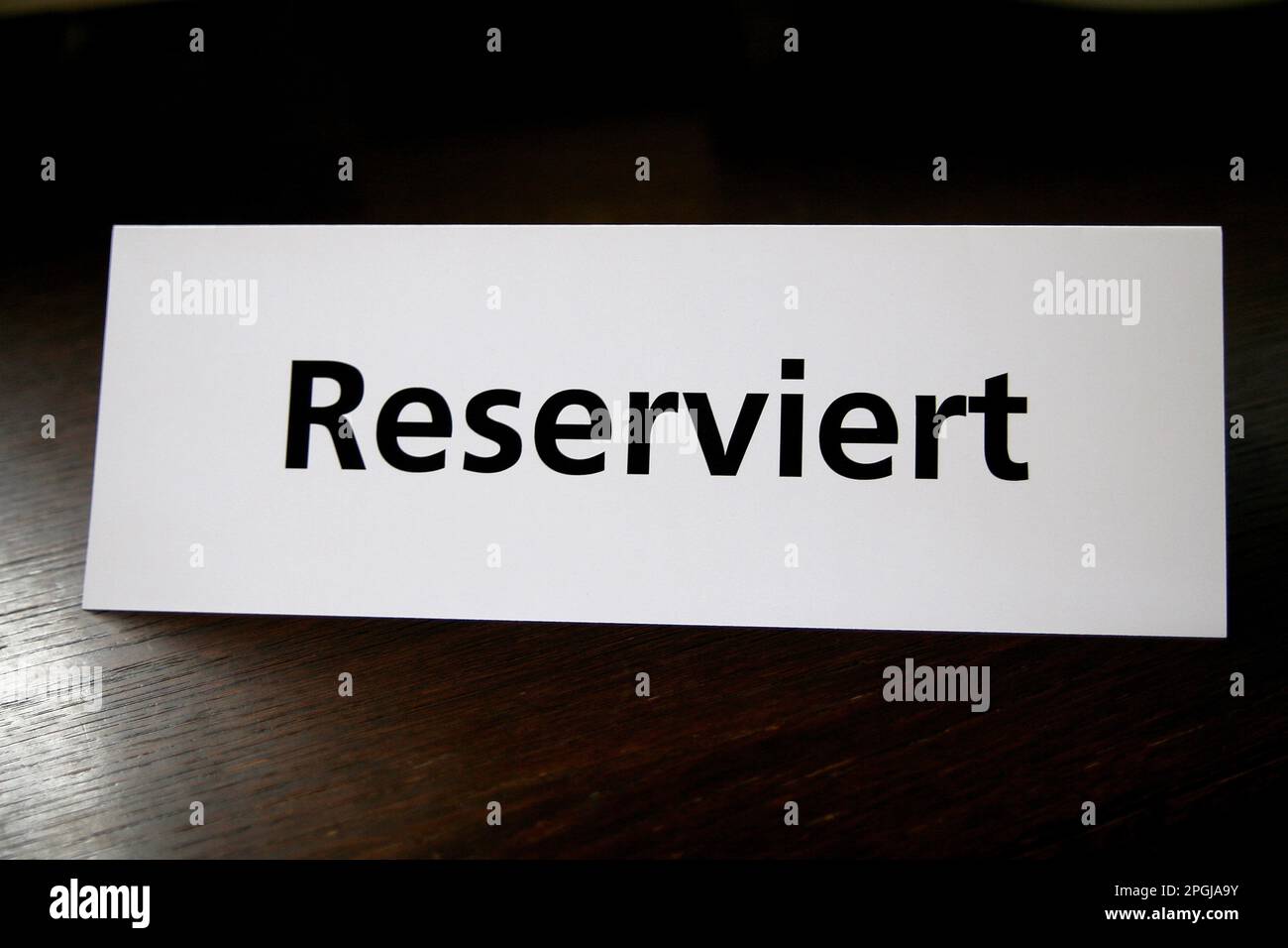 sign lettering reserviert, booked on a table Stock Photo - Alamy