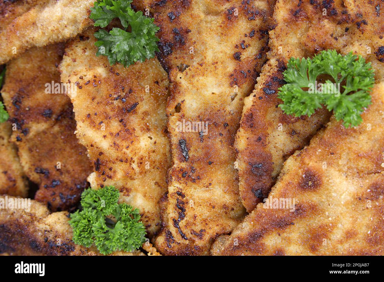 breaded pork schnitzel with parsley Stock Photo - Alamy