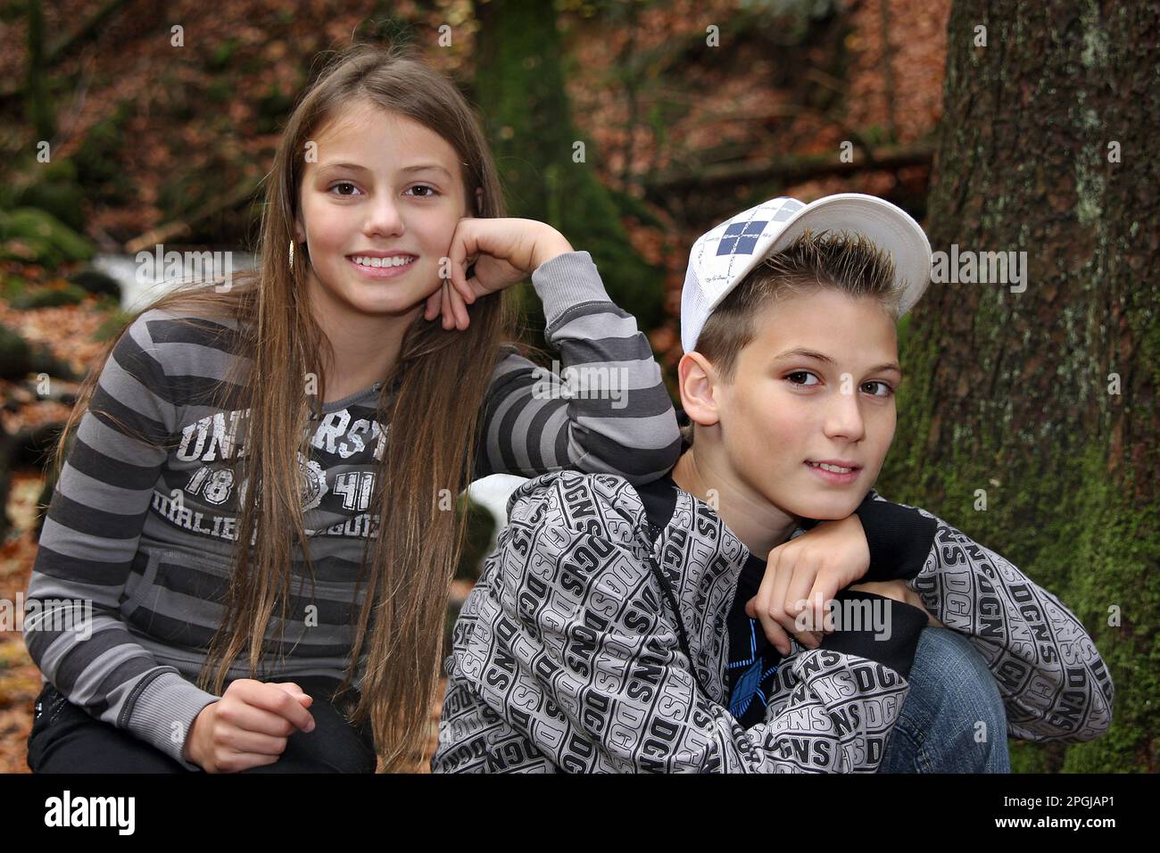 teen siblings together in the woods Stock Photo - Alamy