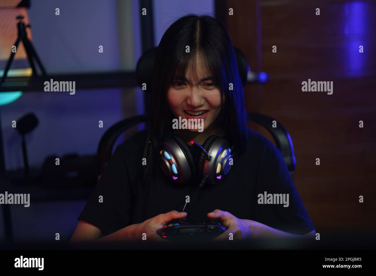 Female cyber hacker gamer using controller joystick to playing games on ...