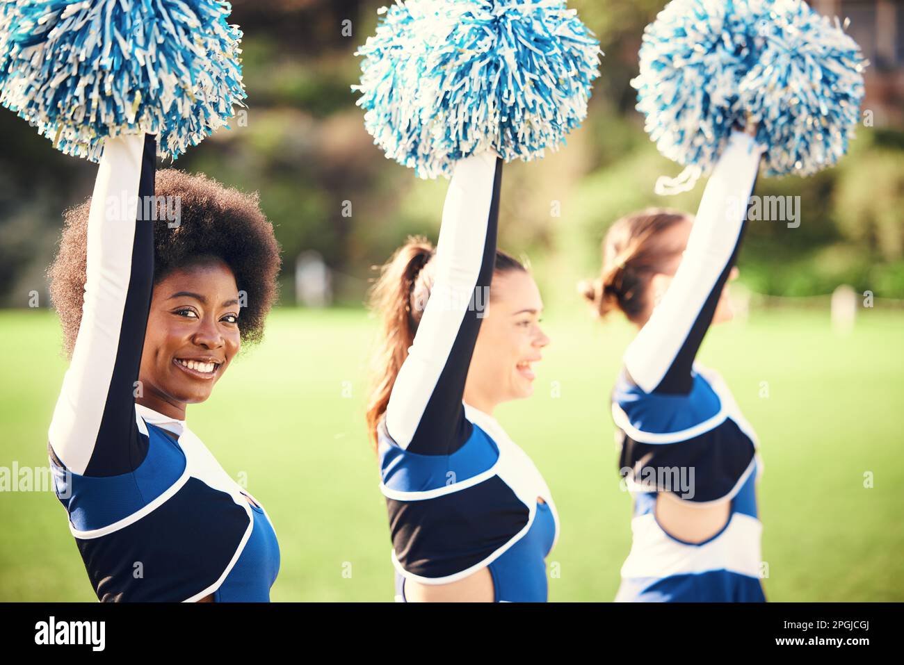 Black woman cheerleader, field and smile in portrait for teamwork or ...