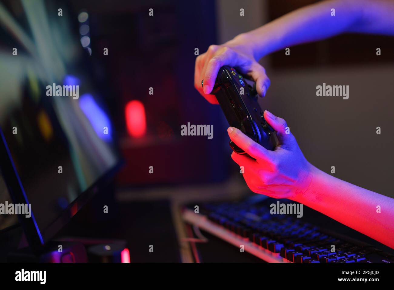 Female cyber hacker gamer use joystick to competition and playing games ...