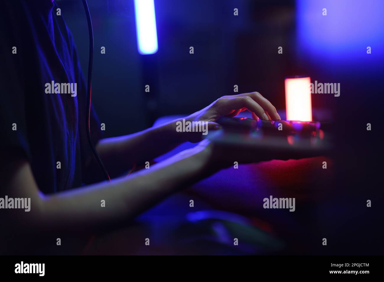 Hand of female cyber hacker gamer pressing on keyboard to competition ...