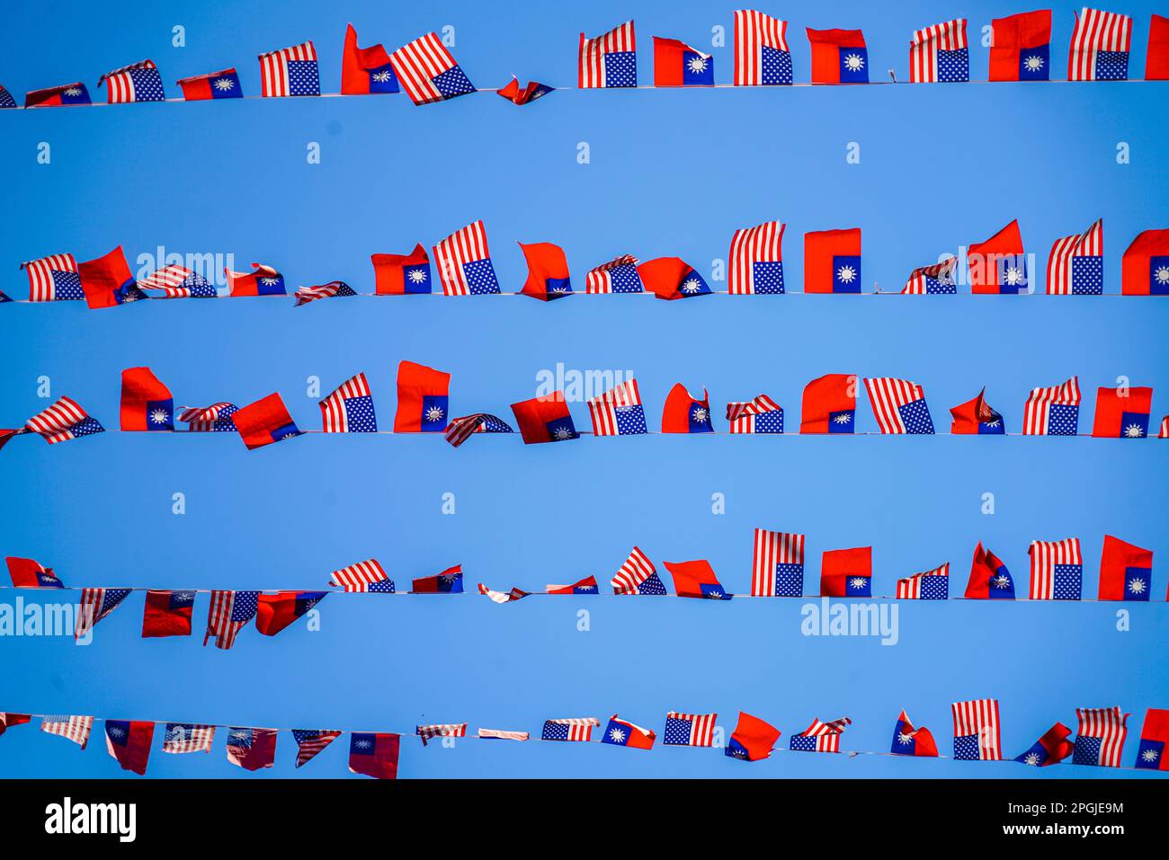 Taiwanese Flag and American Flag hanging together in an alternate order ...