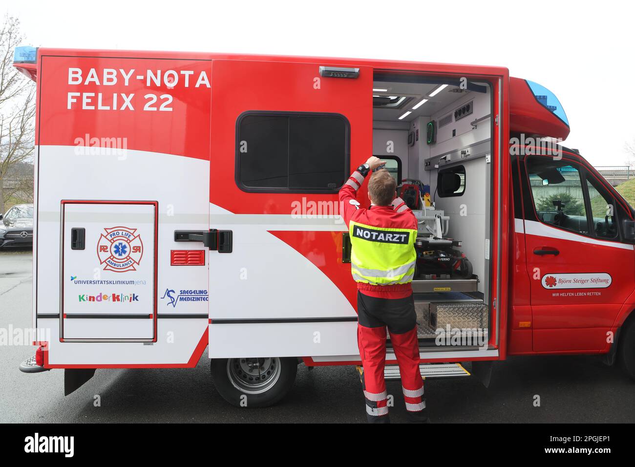 Jena, Germany. 23rd Mar, 2023. An emergency doctor stands by an ...